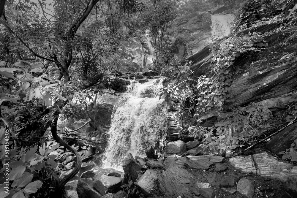 Beautiful Bamni waterfall having full streams of water flowing downhill ...