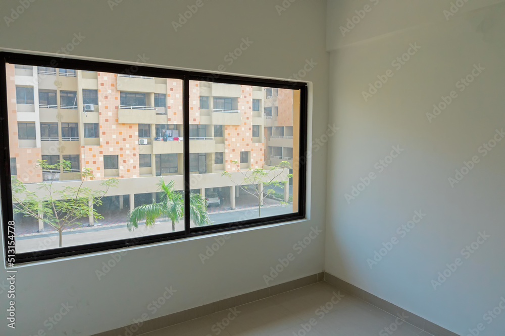 Inside view of window and room of new residential flats being built at ...