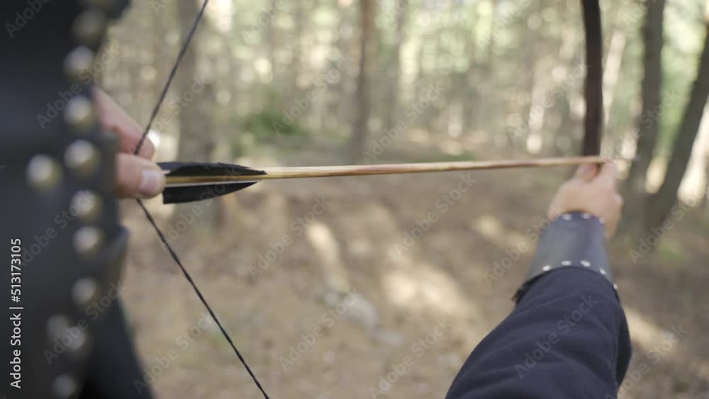 Shooting arrows in historical war gear. Pioneer unit, historical ...