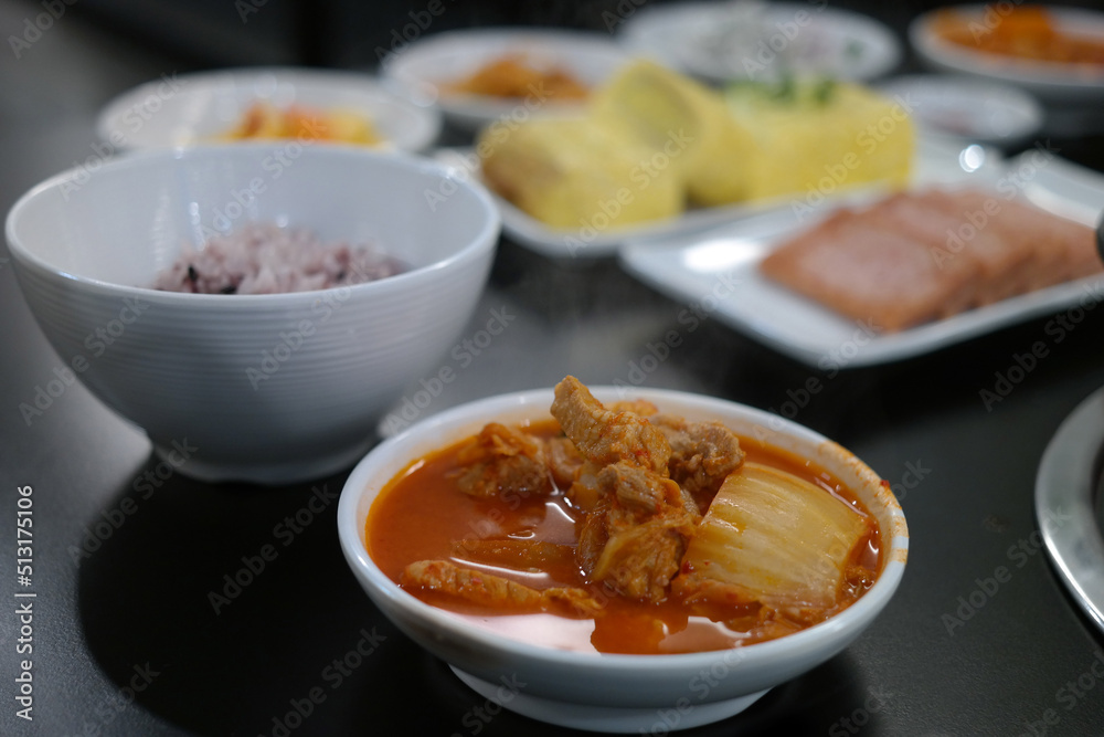 Over-fermented kimchi boiled with pork, bean curd, and green onion ...