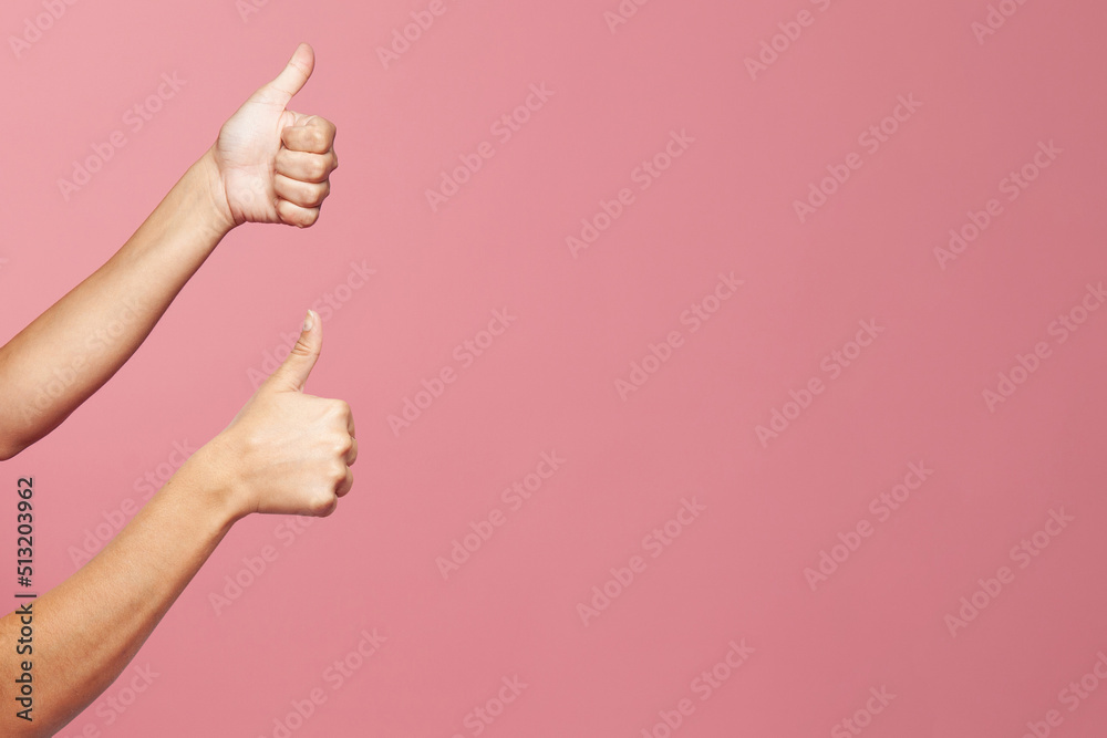 Thumbs up gesture over pink background Stock Photo | Adobe Stock