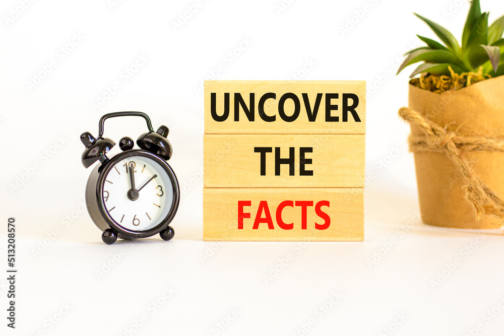 Uncover the facts symbol. Concept words Uncover the facts on wooden ...