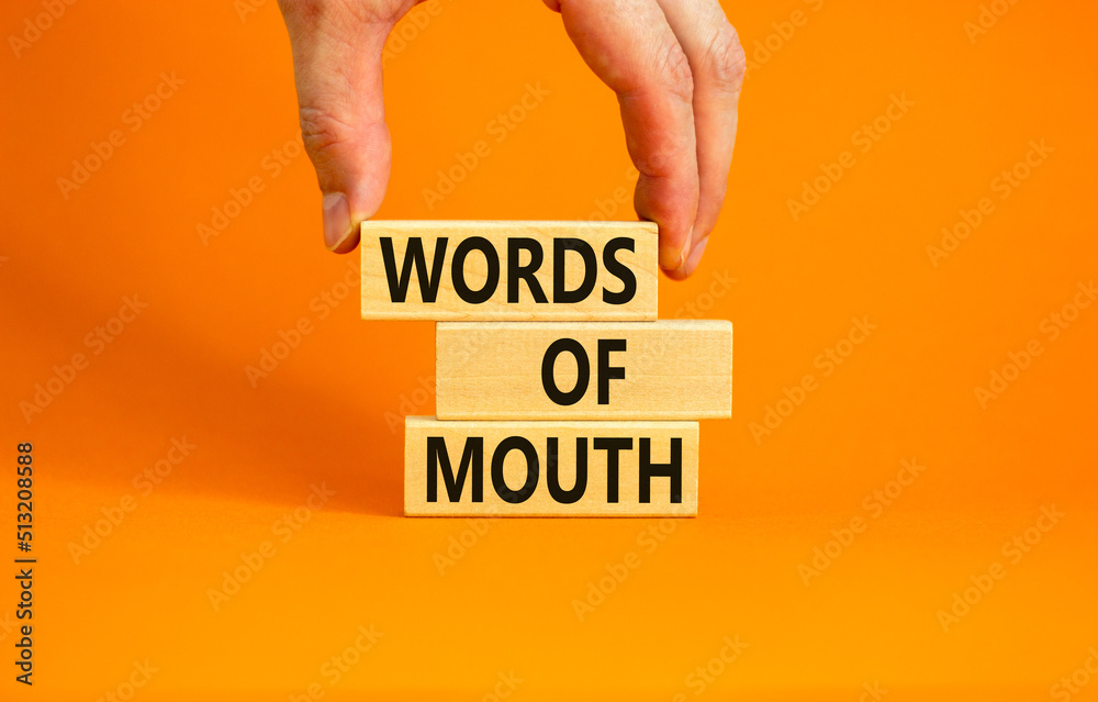 Words of mouth symbol. Concept words Words of mouth on wooden blocks on ...