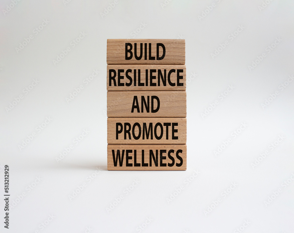 Build Resilience and Promote Wellness symbol. Wooden blocks with words ...