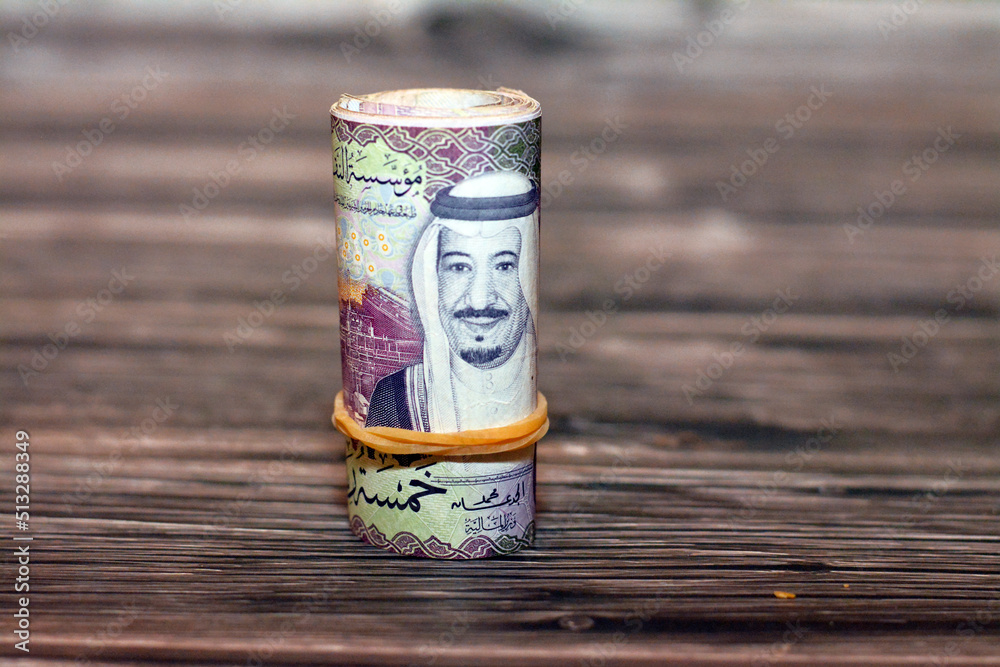 5 SAR five Saudi riyals cash money banknote bills rolled up with rubber ...