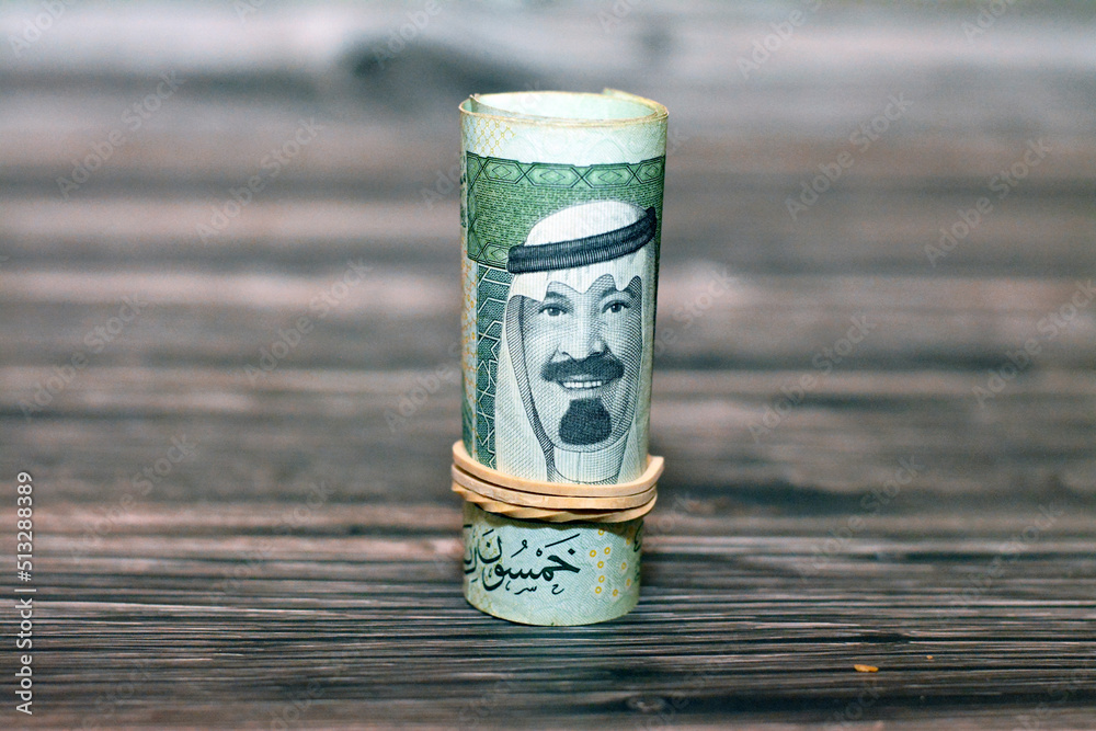 50 SAR fifty Saudi riyals cash money banknote bills rolled up with ...