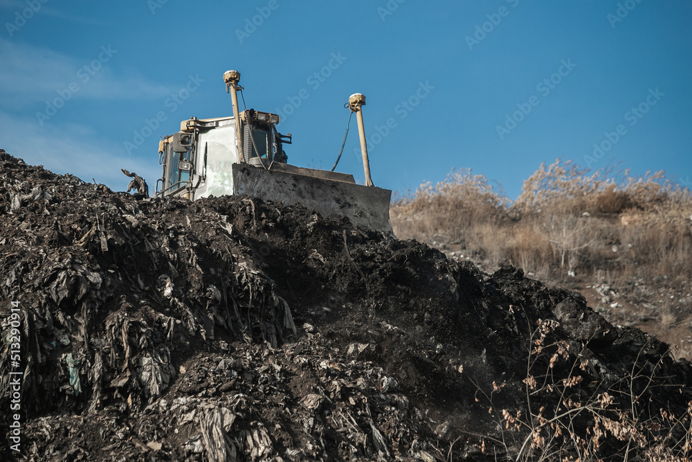 Recycling concrete and construction waste from demolition. Excavator at ...