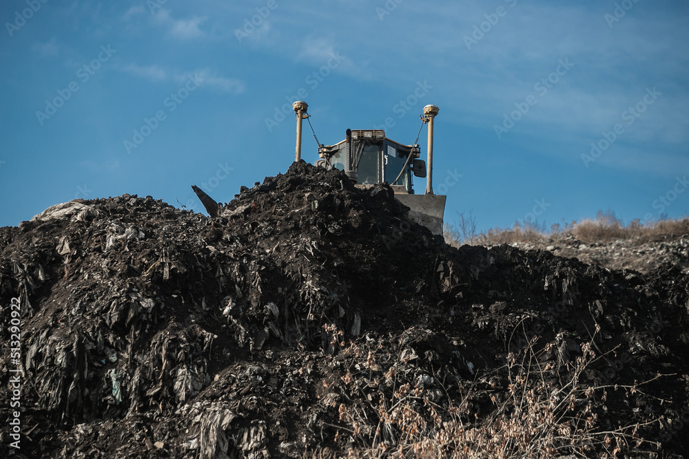 Recycling concrete and construction waste from demolition. Excavator at ...