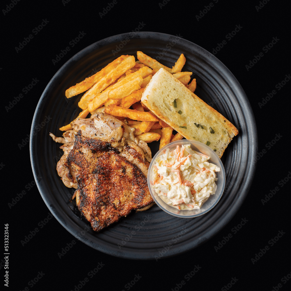 rilled Chicken Chop with french fries served in a dish side view on ...