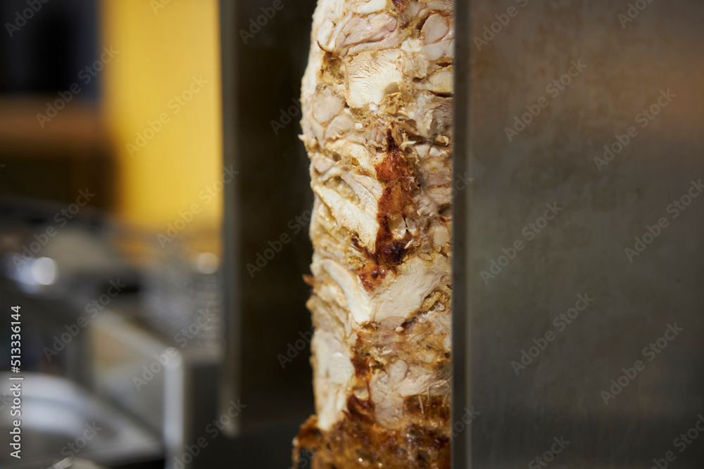 shawarma on a spit. Doner kebab on a rotating vertical spit ...