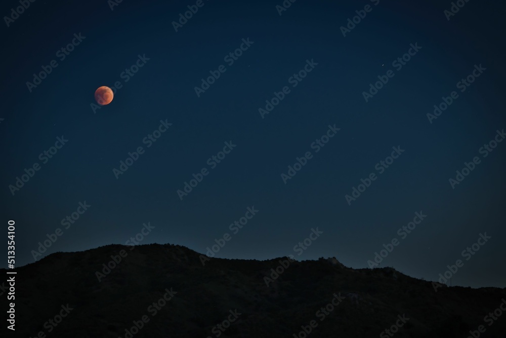 Mysterious view of a night sky with red moon in Los Angeles, California ...
