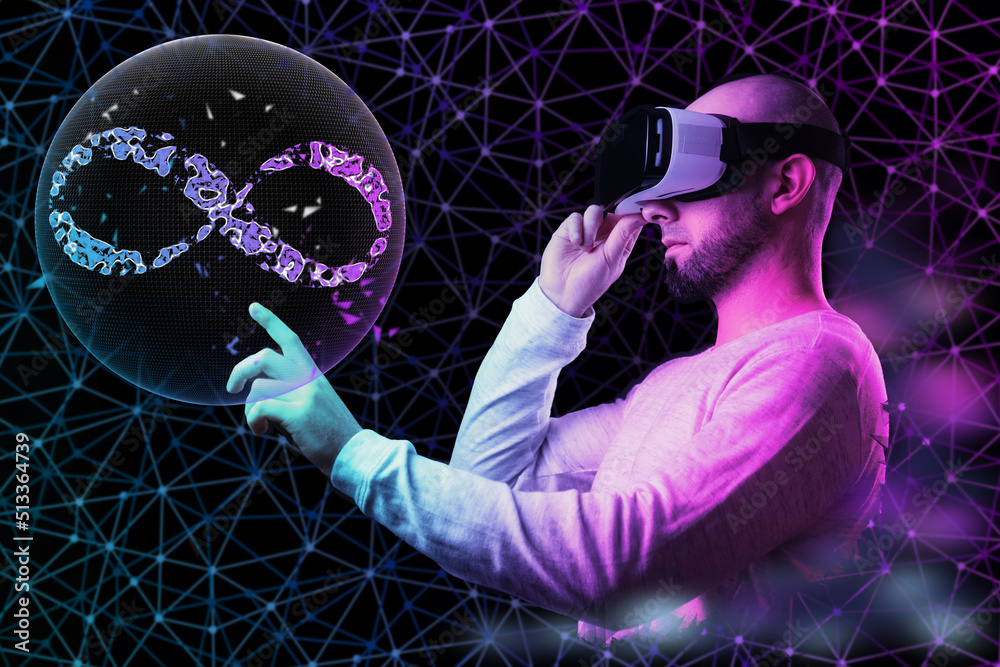 Portrait of young man in VR glasses point on 3D simulation of sphere ...