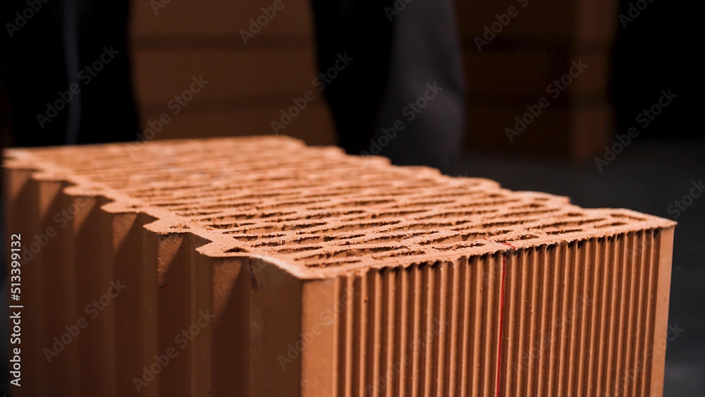 Building a house from a red ceramic block. Stock footage. Block masonry ...