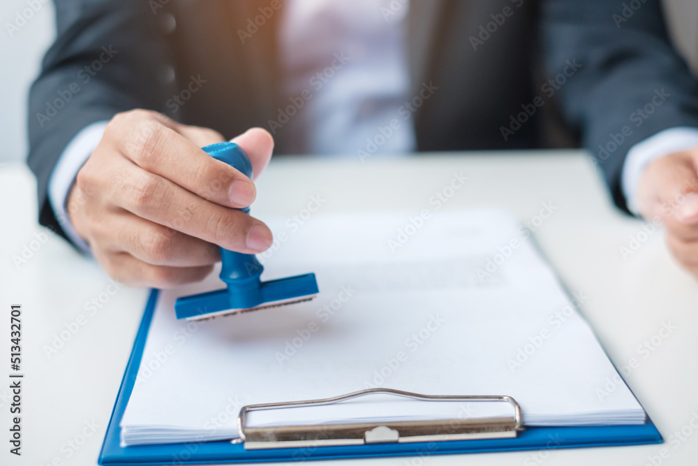 Businessman stamp during signing contract document.Business contract ...