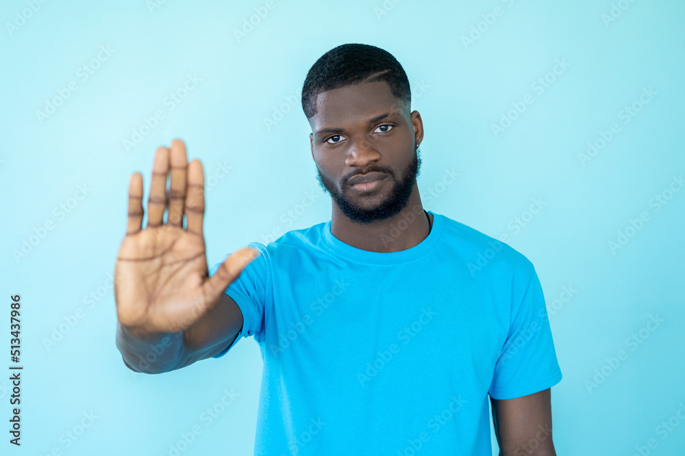 Stop gesture. Rejecting man. Warning sign. Racial tolerance. Serious ...