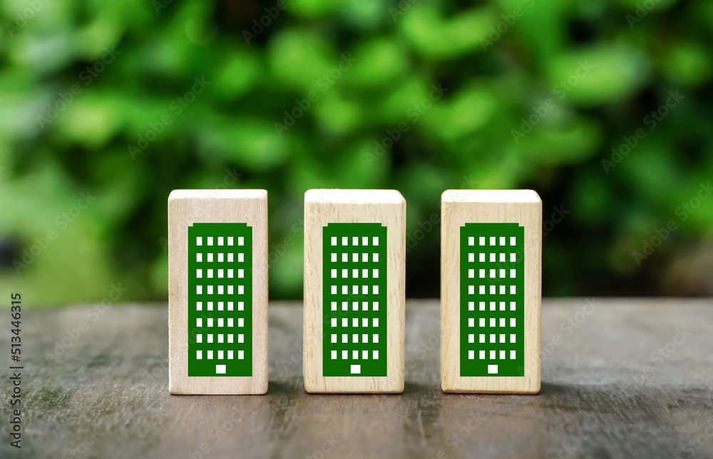 Green and eco building concept. wooden cubes with green building ...