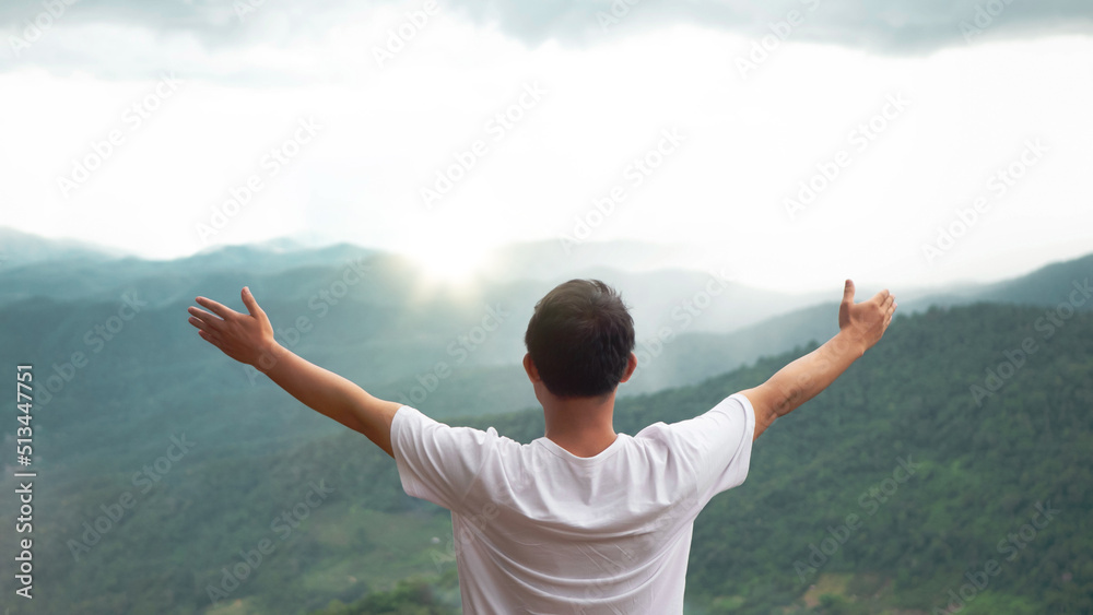 Copy space of man rise hand up on top of mountain and sunset sky nature ...