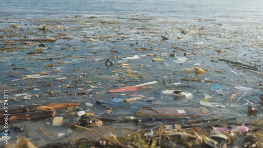 Concept of pollution of seas, lakes and rivers. Plastic trash and waste ...
