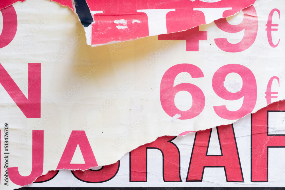 Red text and price numbers on an old and torn street poster background ...