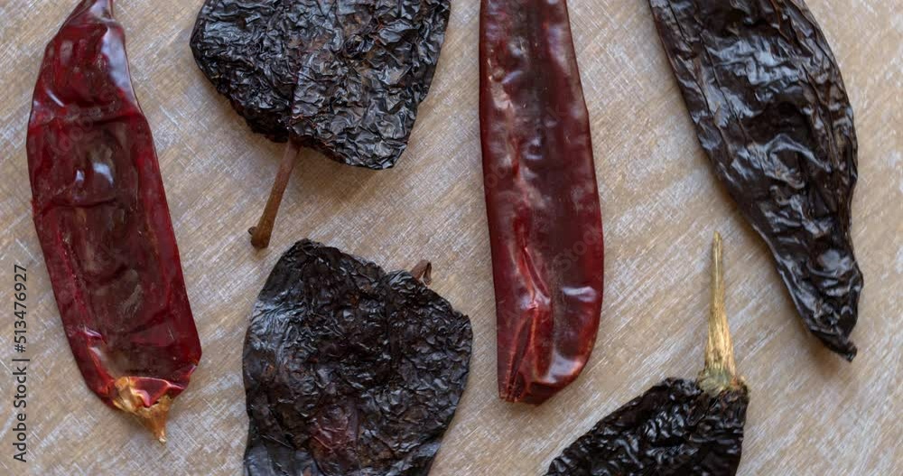 Dry chili peppers: Guajillo, Ancho and Pasilla top view. Table spin ...