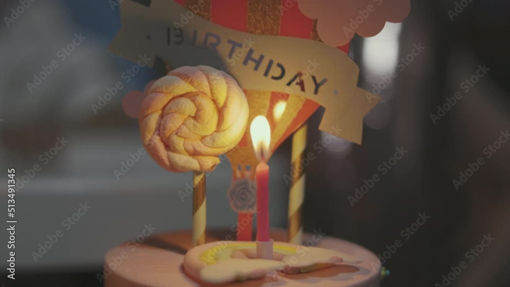 Close up 4K of candle light and flaming on delicious birthday cake with ...