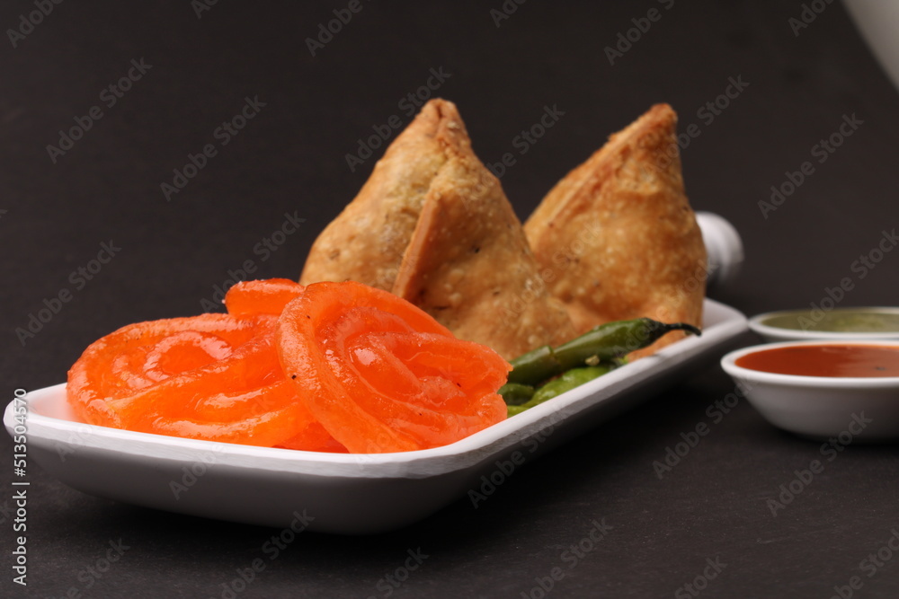 samosa and jalebi or jilebi served with red and green chutney Stock ...