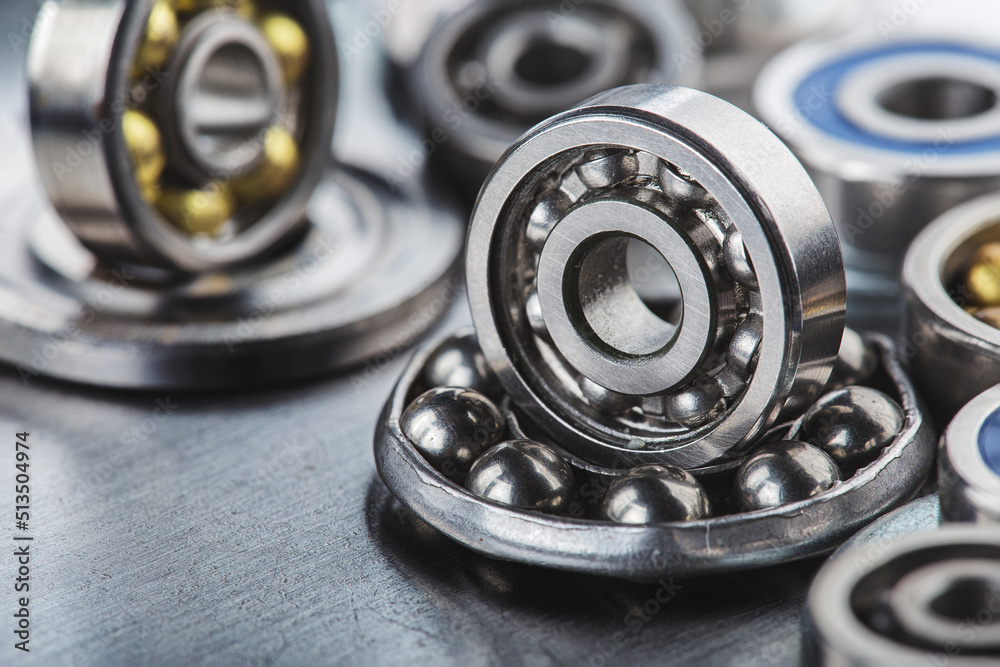 different bearings on a metal background. Part of mechanism. Stock ...