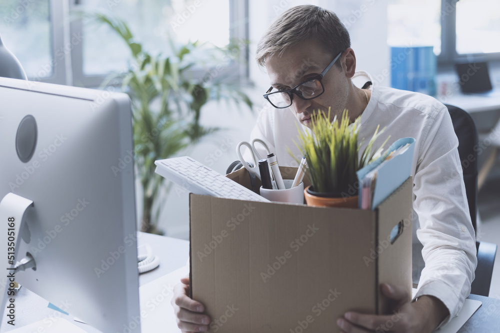 Fired office worker leaving the office Stock Photo | Adobe Stock
