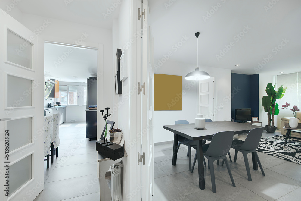 Distributor of a modern house with a living room with a wooden dining ...