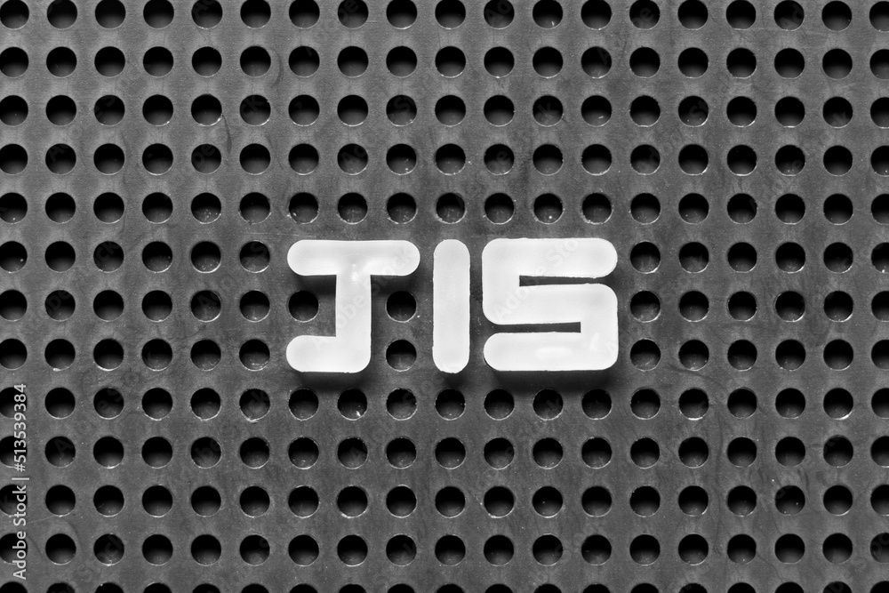 White alphabet letter in word JIS (abbreviation of Just in sequence) on ...