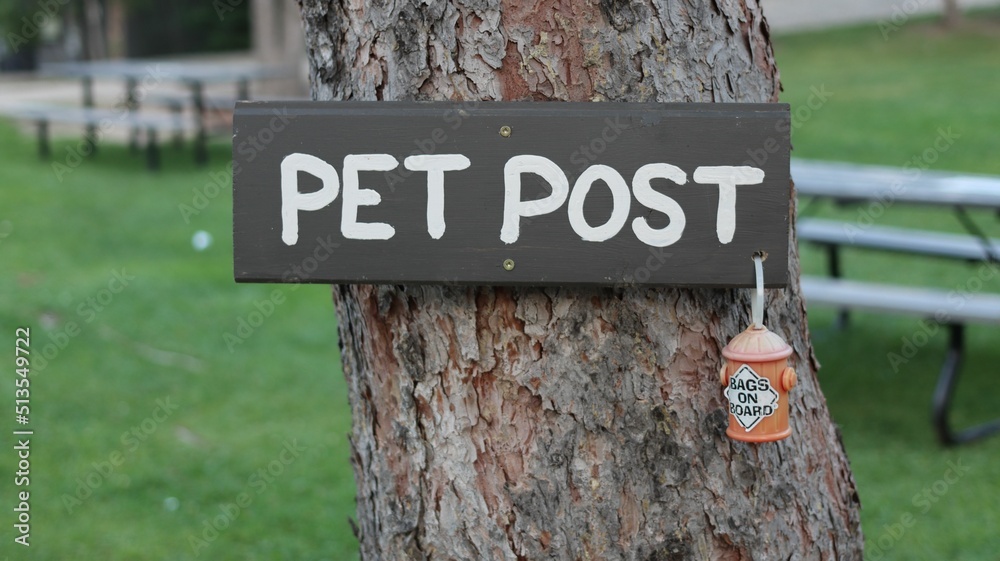 Pet post sign with little doggy hydrant baggy near Caddy Lake, Manitoba ...