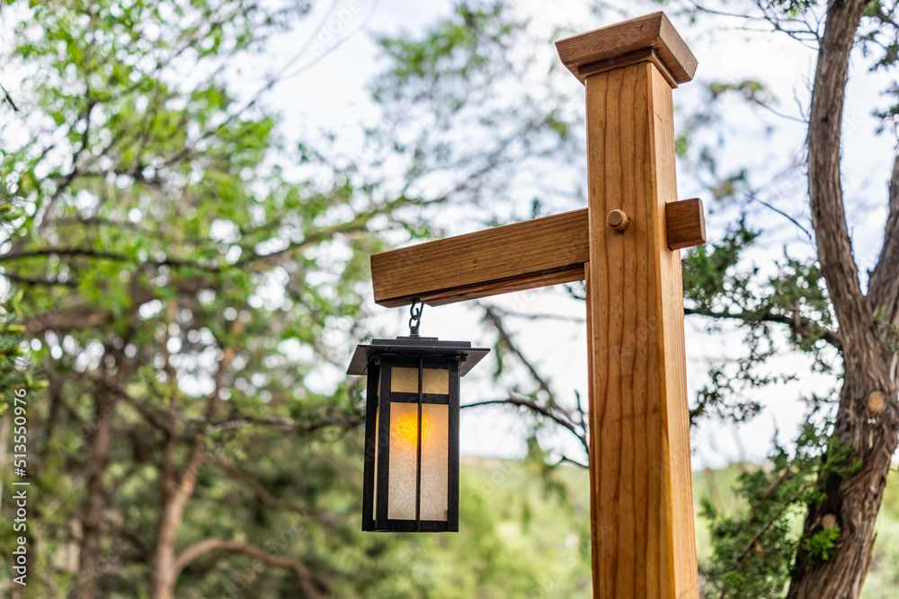 Japanese style garden with illuminated hanging lantern lamp light on ...