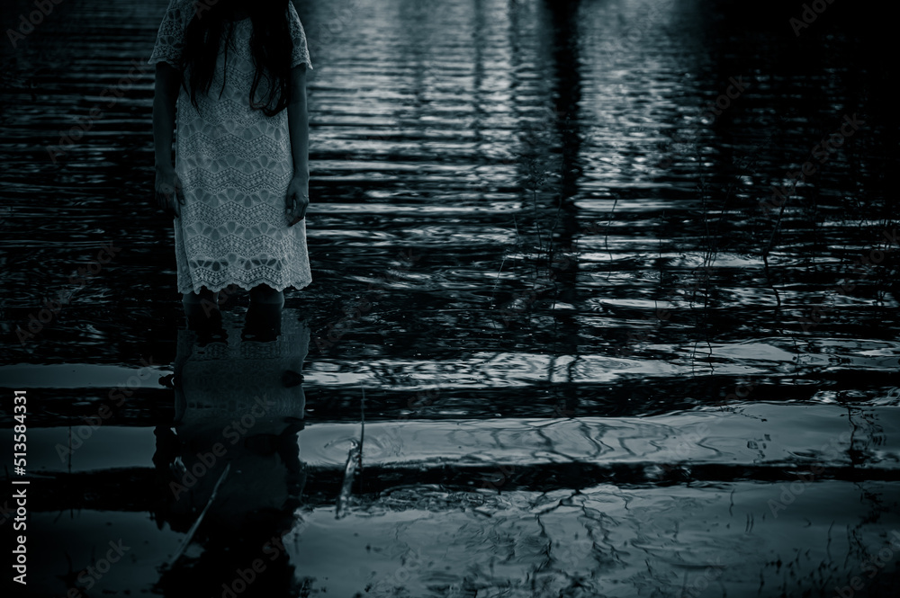 Portrait of asian woman make up ghost face at the swamp,Horror in water ...