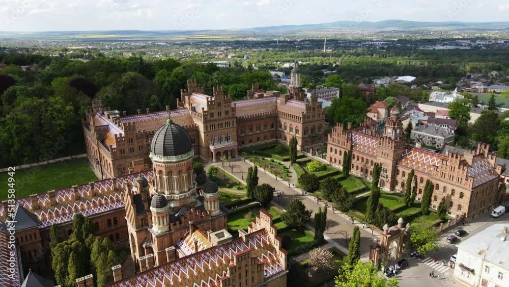 Old historical university building with towers, domes. Around the ...
