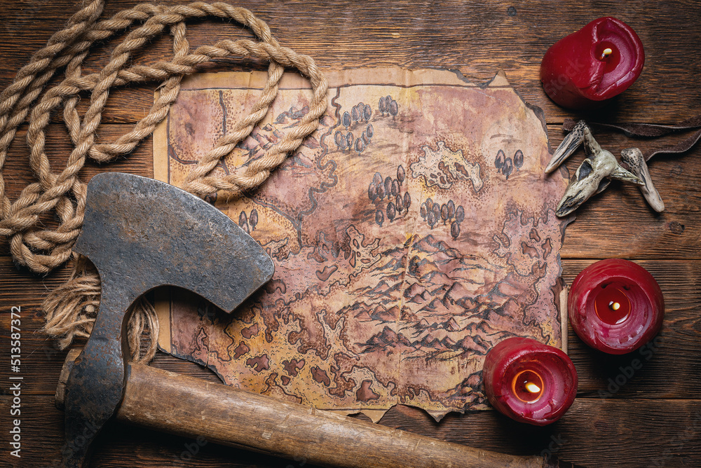 Map of ancient lands. Ancient journey concept. Old map and battle axe ...