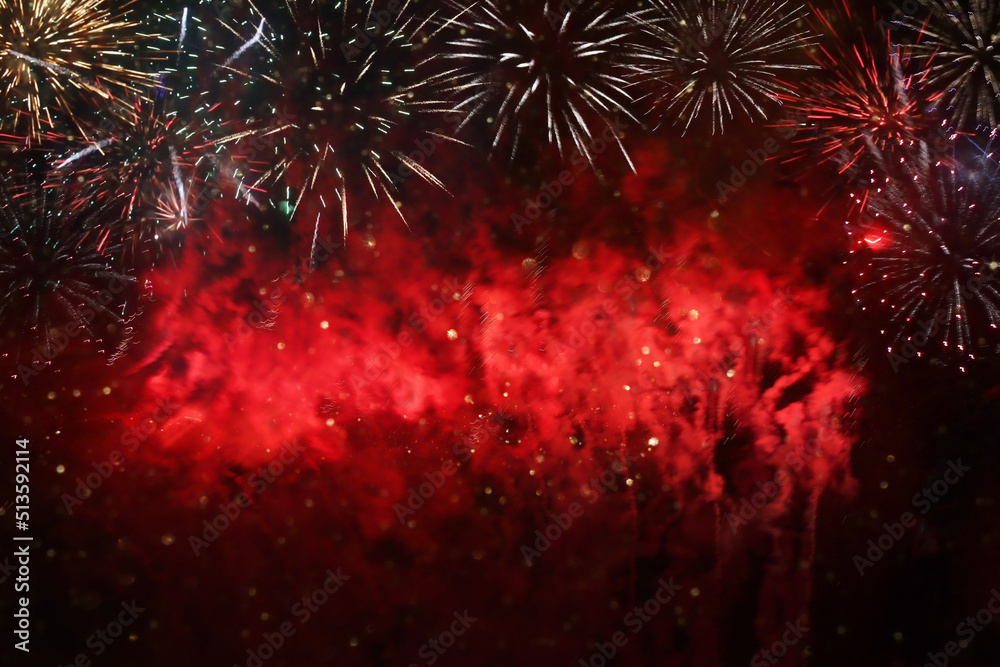 abstract black, red and gold glitter background with fireworks ...