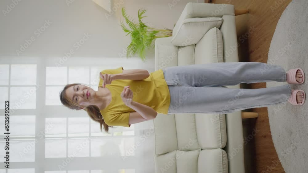Asian woman influencer smile enjoy with dancing live streaming at home ...