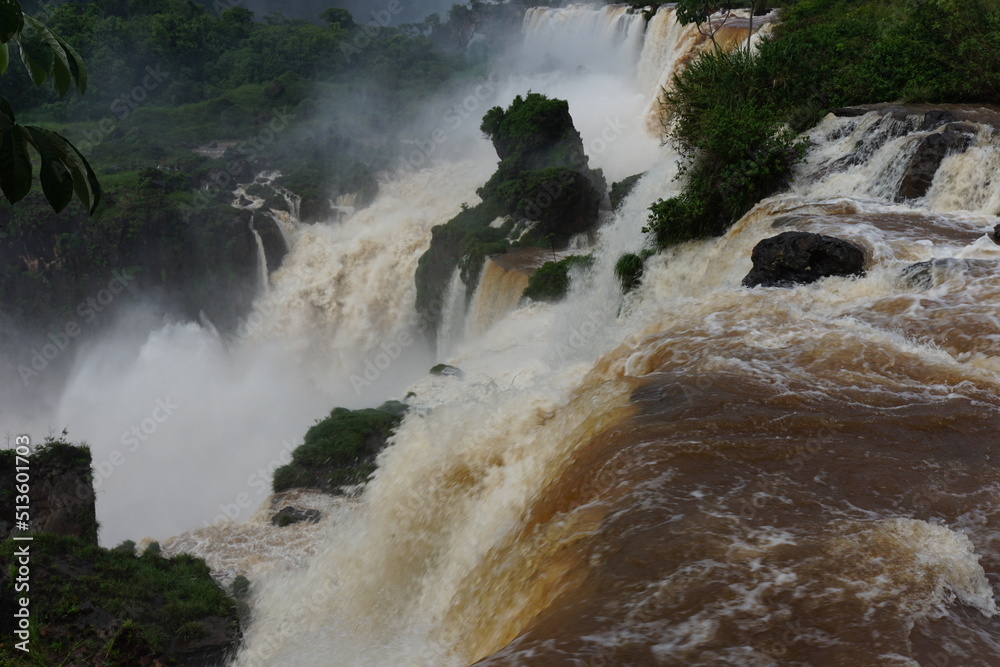 The photo shows a stunning view from the top of the Iguazu Falls — a ...