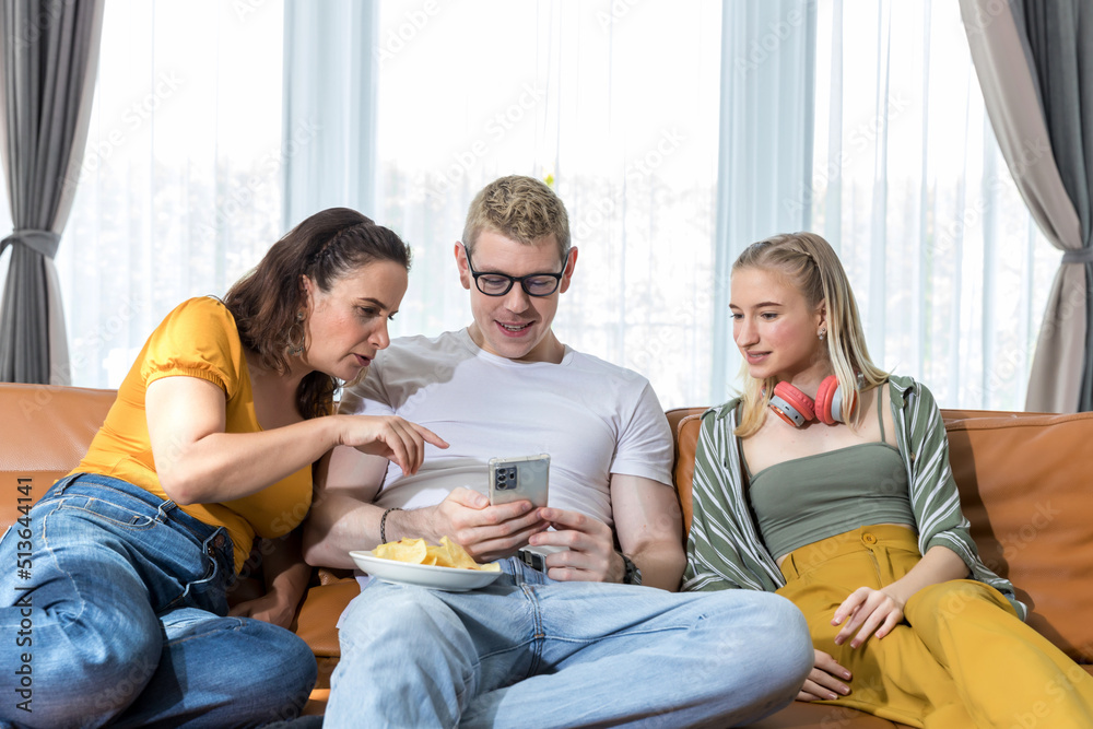 Family smiling in front of camera during live streaming in social ...