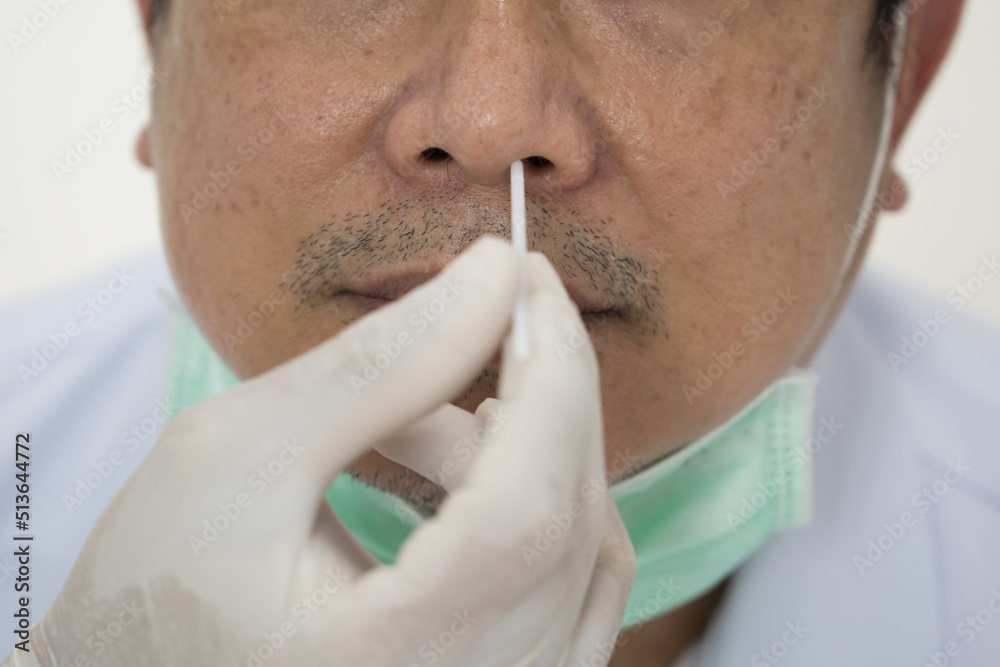 A man self collecting nose swab for corona virus sample.Covid-19 ...