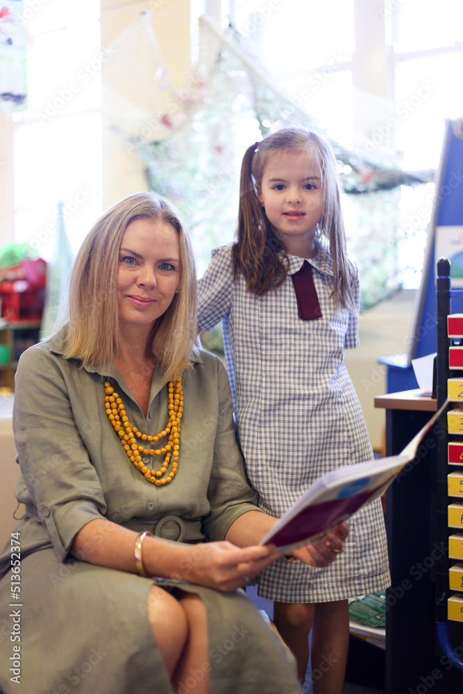 School girl and her teacher smiling at the camera Stock Photo | Adobe Stock