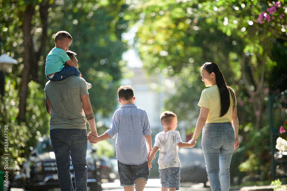 Family Walking Together In Street