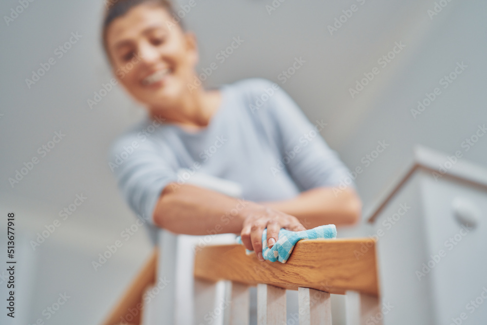 Picture of woman cleaning stair steps or railing Stock Photo | Adobe Stock