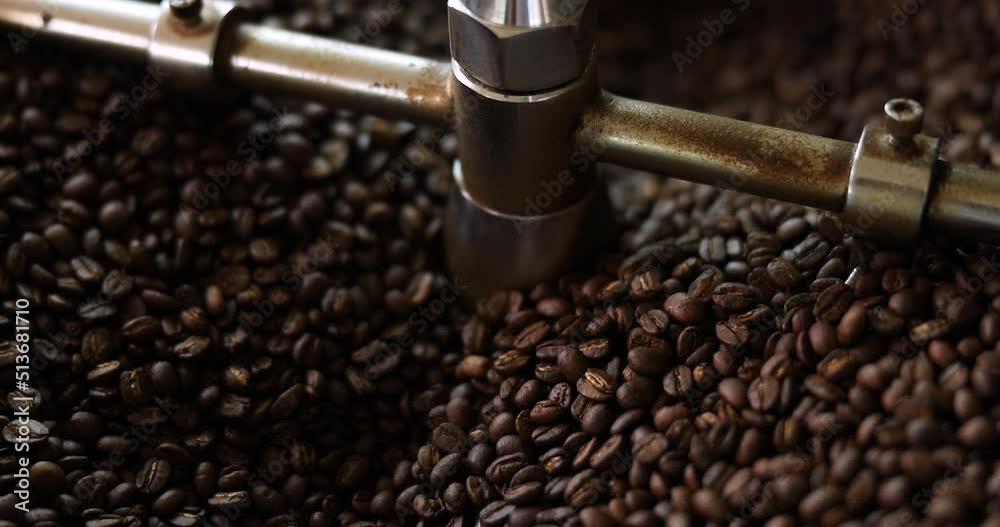 close up blured and manual focus moving camera of coffee roaster spin ...