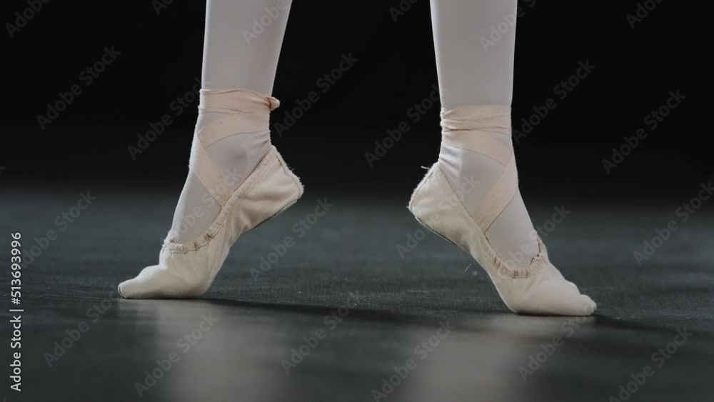 Unrecognizable girl dancer ballerina female legs rise lifting up pointe ...
