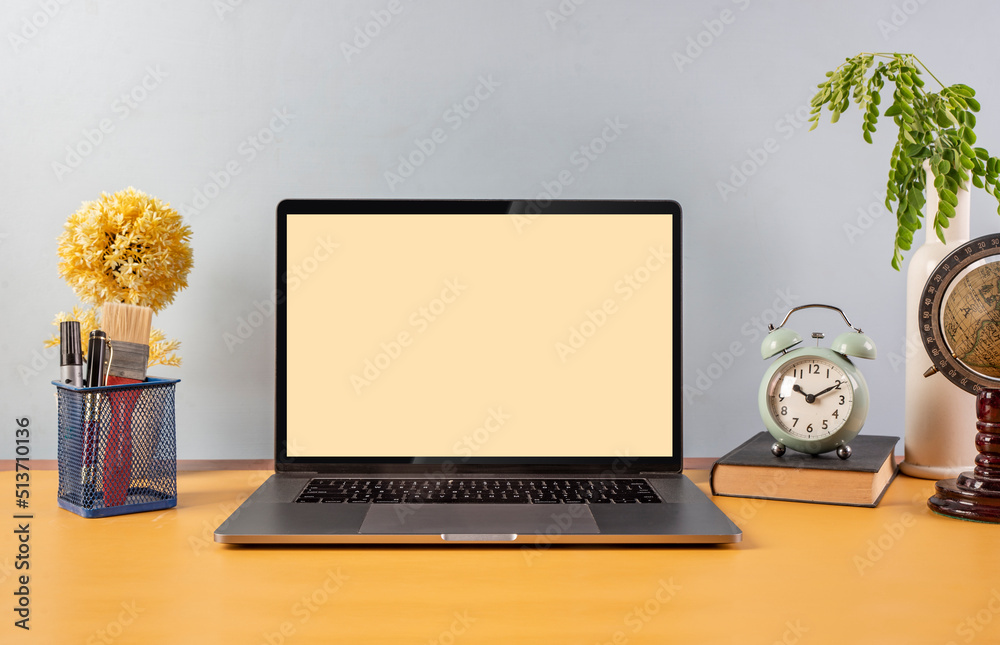 Mockup of modern blank screen lap on office table Stock Photo | Adobe Stock