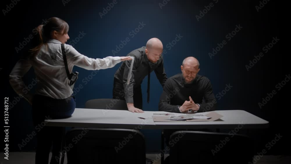 Police interrogation without lawyer. Detective cop shows knife in blood ...