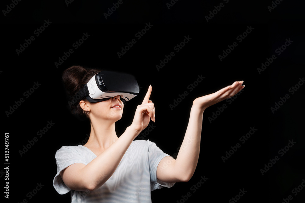 Metaverse. Portrait of woman in VR glasses point with finger at space ...
