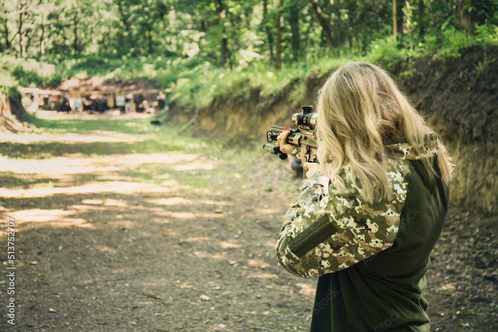 Ukrainian woman shooting from a machine gun Ar-15 Stock Photo | Adobe Stock