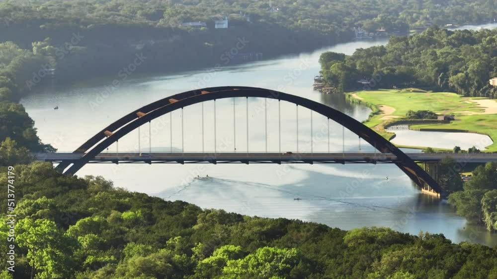 Rising up to reveal Pennybacker 360 bridge in Austin, Texas over Lake ...